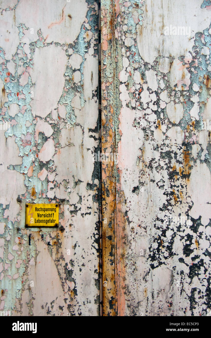 rusty door with warning sign Stock Photo - Alamy