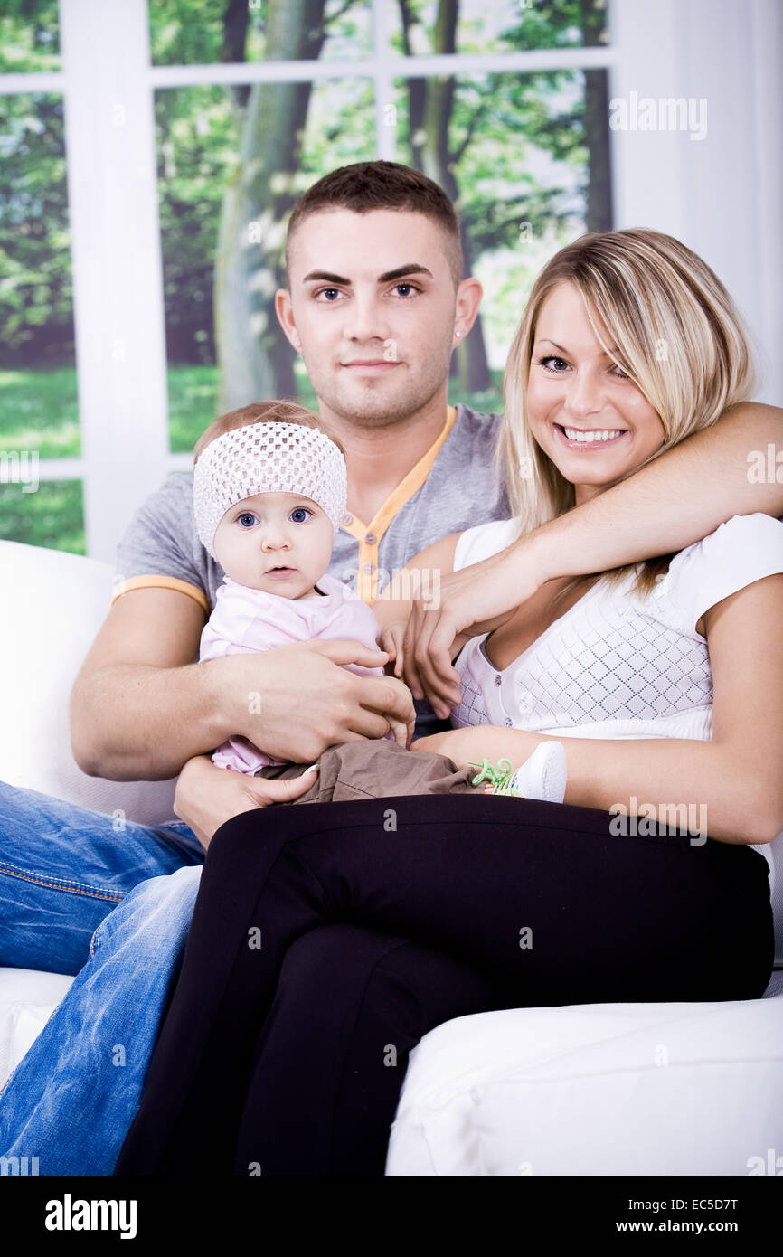 the happy young family inside the flat Stock Photo - Alamy
