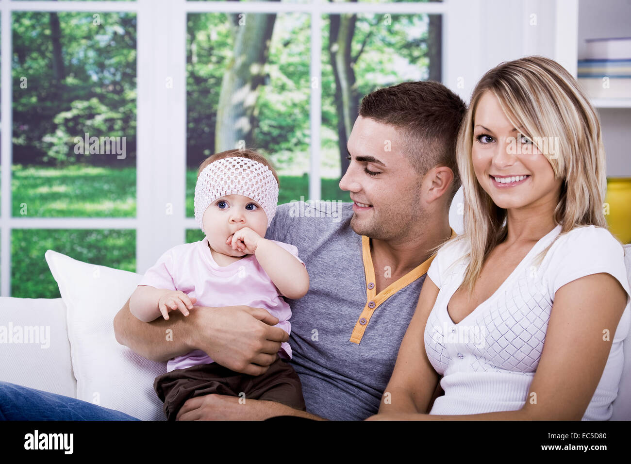 the happy young family inside the flat Stock Photo - Alamy
