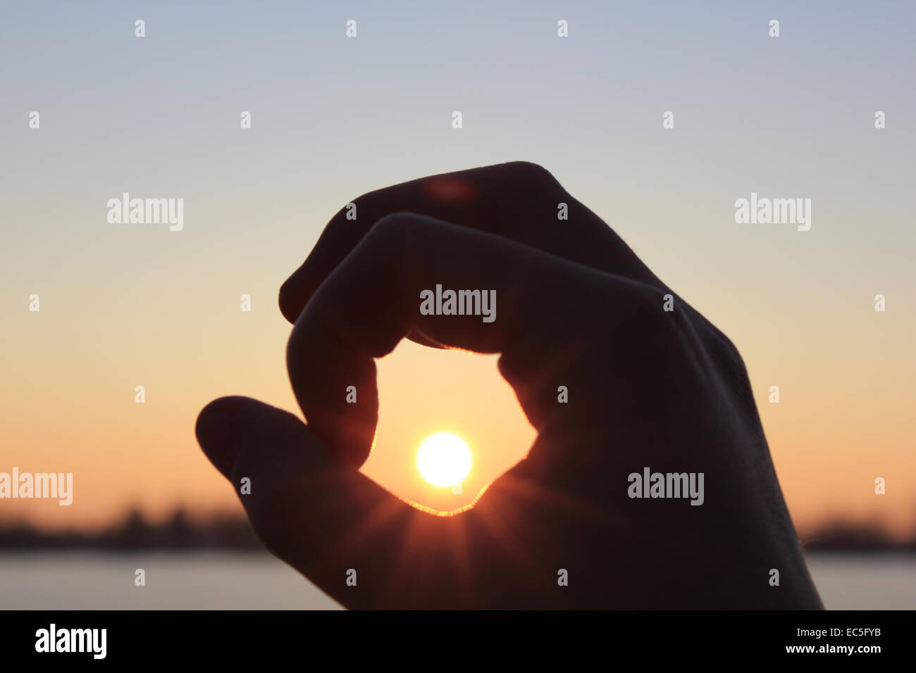 sun in hand Stock Photo - Alamy
