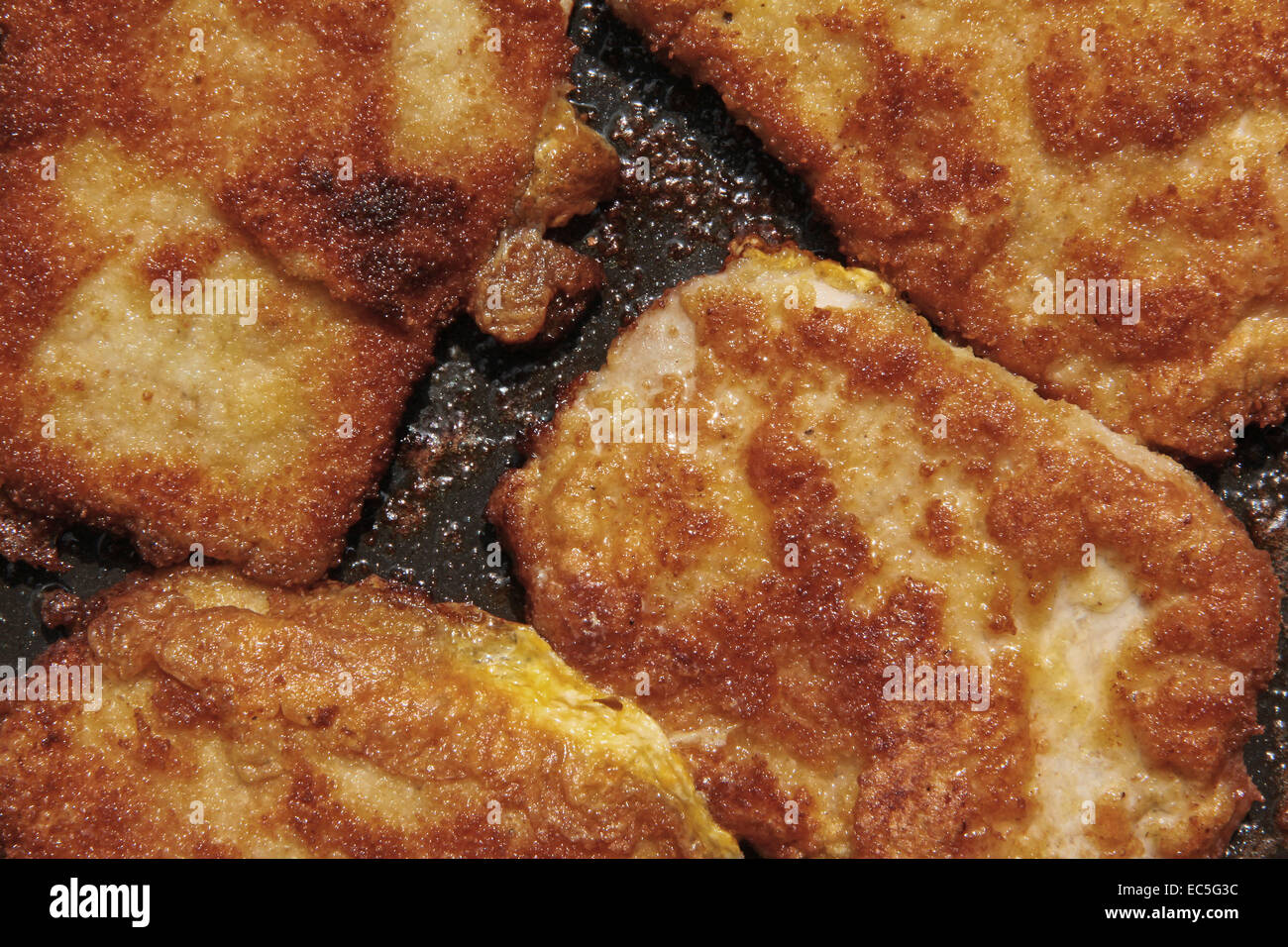 Breaded escalope in a pan Stock Photo - Alamy
