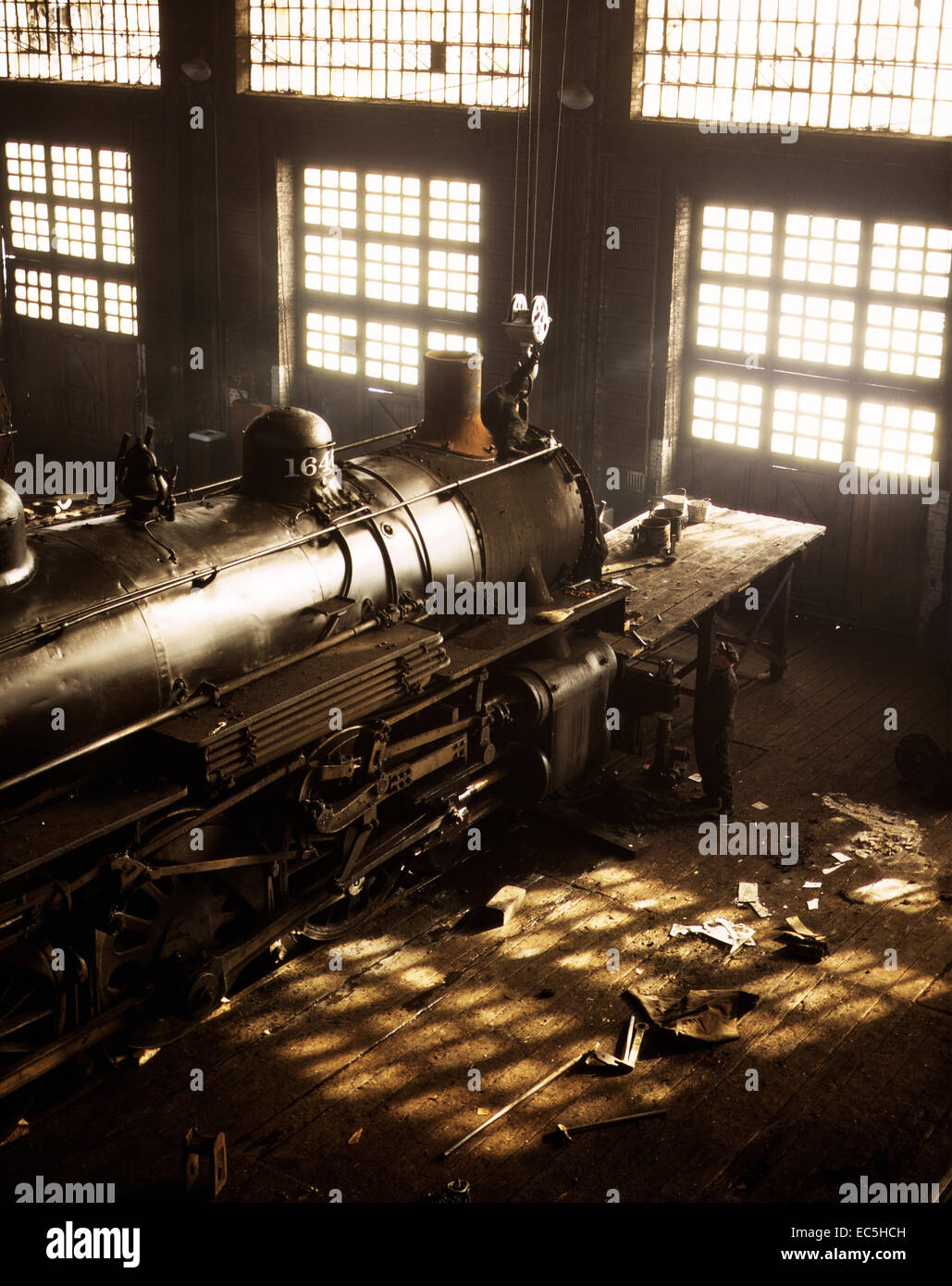 C & NW Railroad workers, working on a locomotive at the 40th Street ...