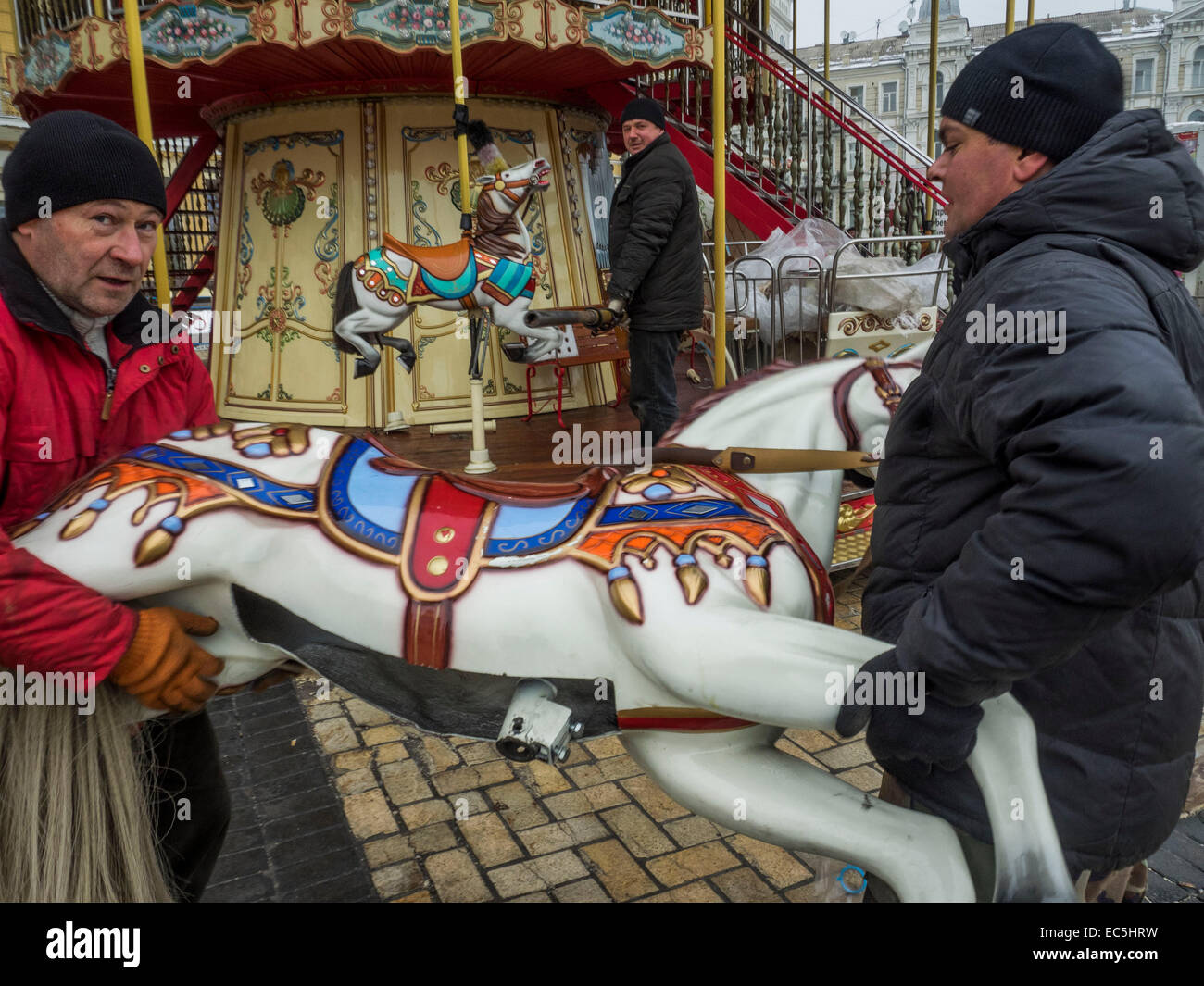 Workers install the massive 25-meter Christmas tree in Kiev near Saint ...