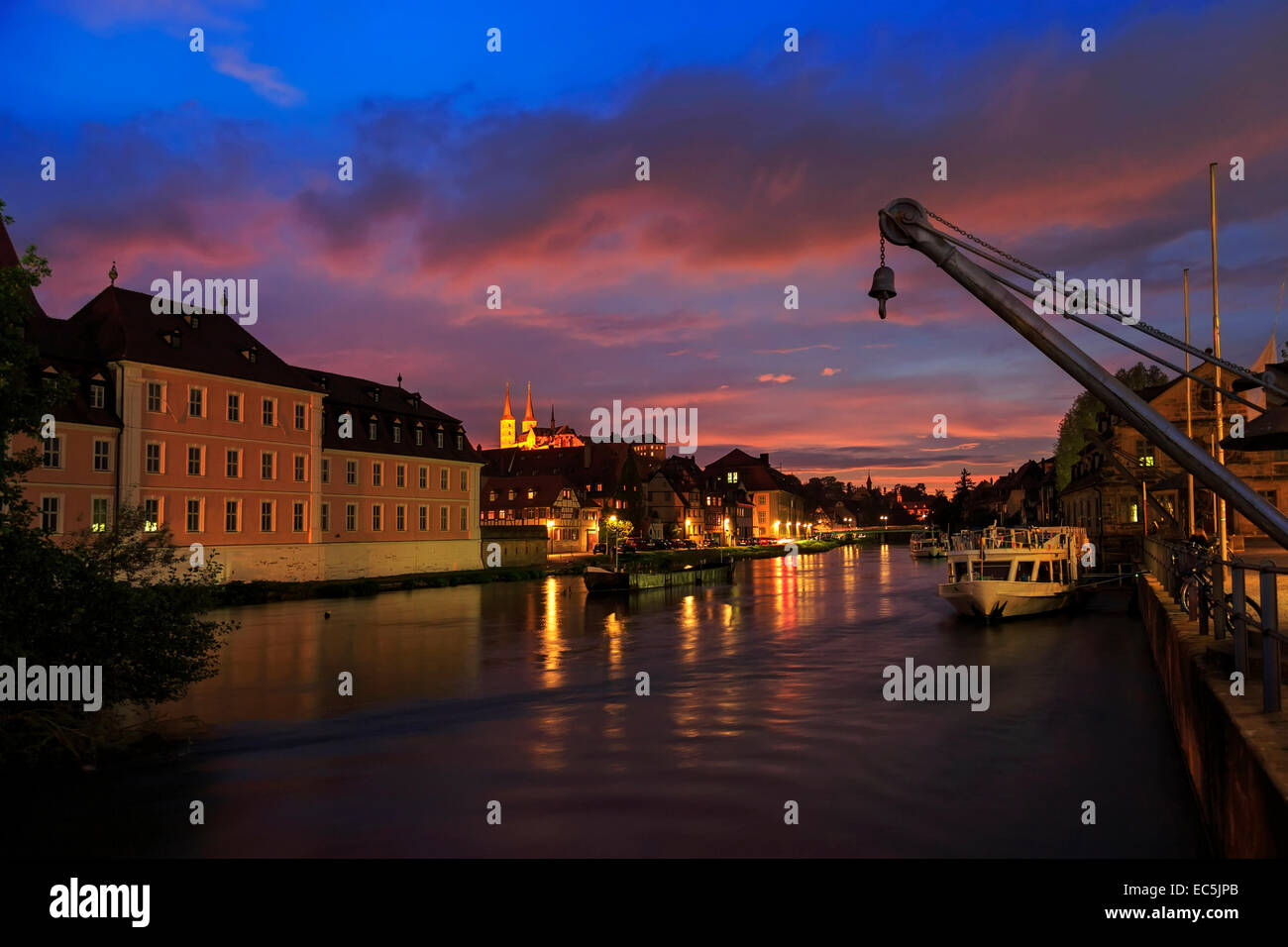 Cloudy sky at sunset, Regnitz river with ships in Bamberg, Germany ...