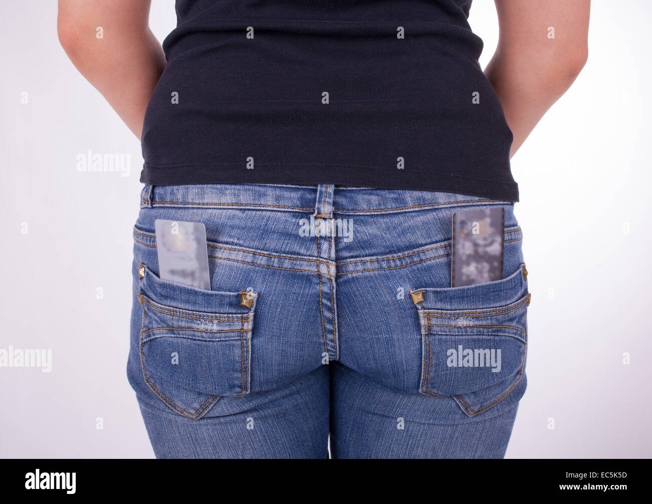 A young woman has credit cards in her pocket Stock Photo - Alamy