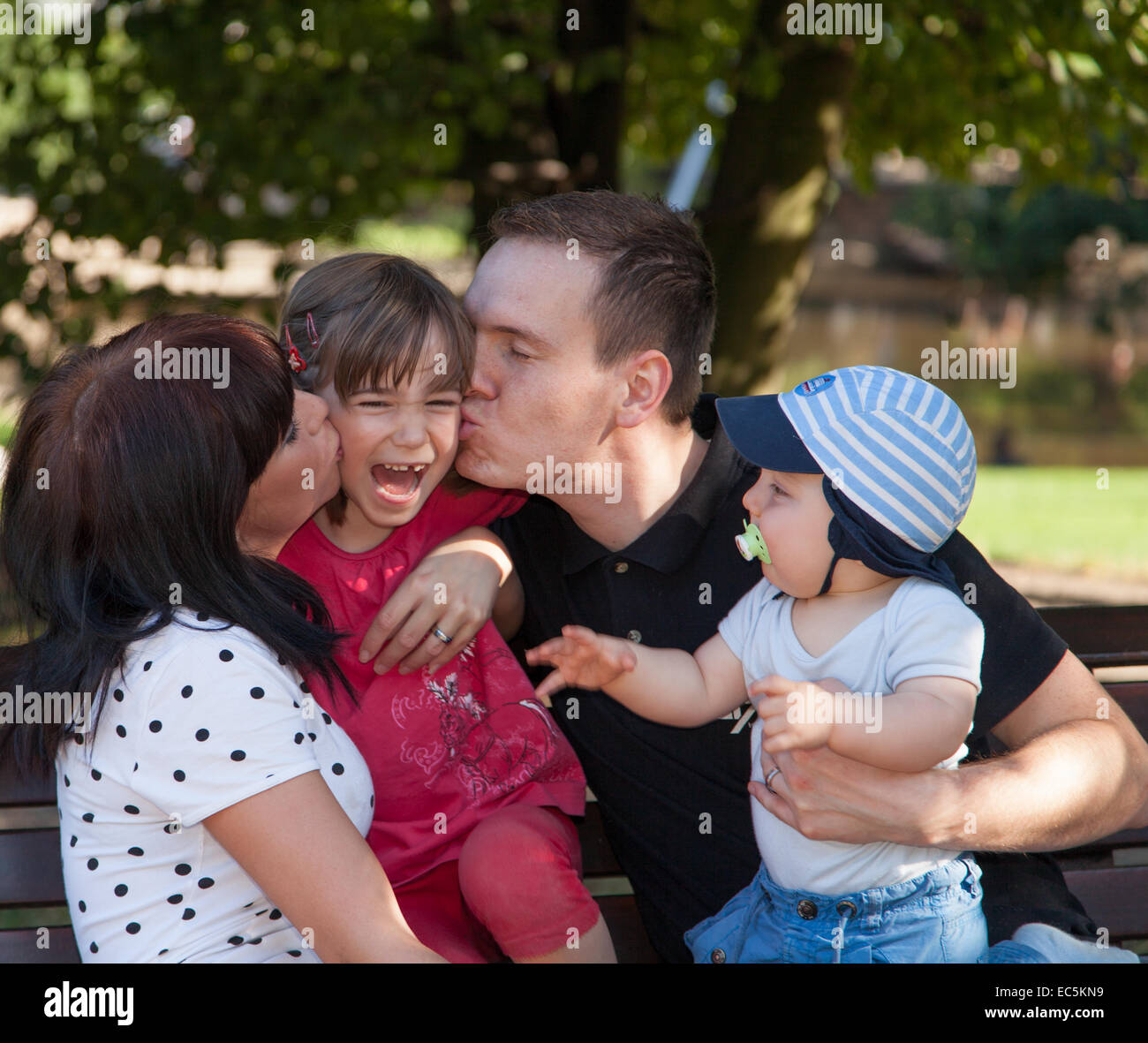 A young family have a break Stock Photo - Alamy