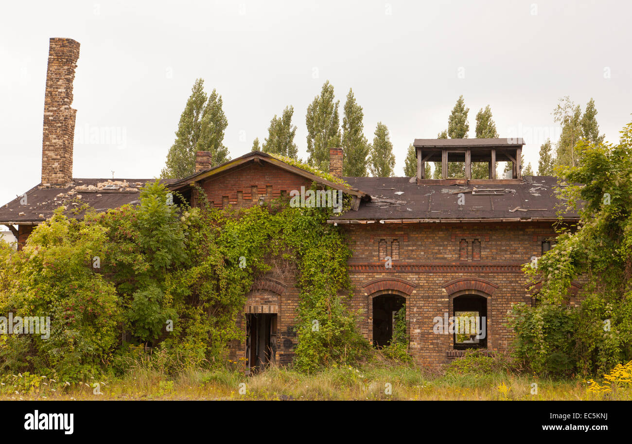 A house with an old ruined smoke stack Stock Photo - Alamy