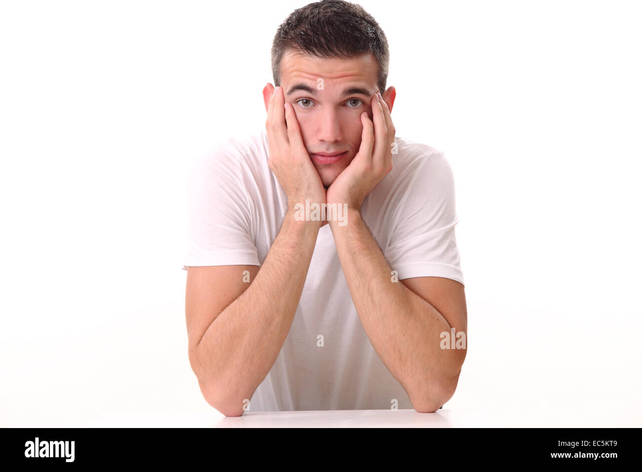 young man sitting at the table Stock Photo - Alamy