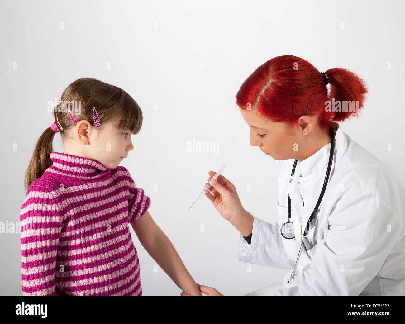 The young pediatrician inoculating a small girl Stock Photo - Alamy