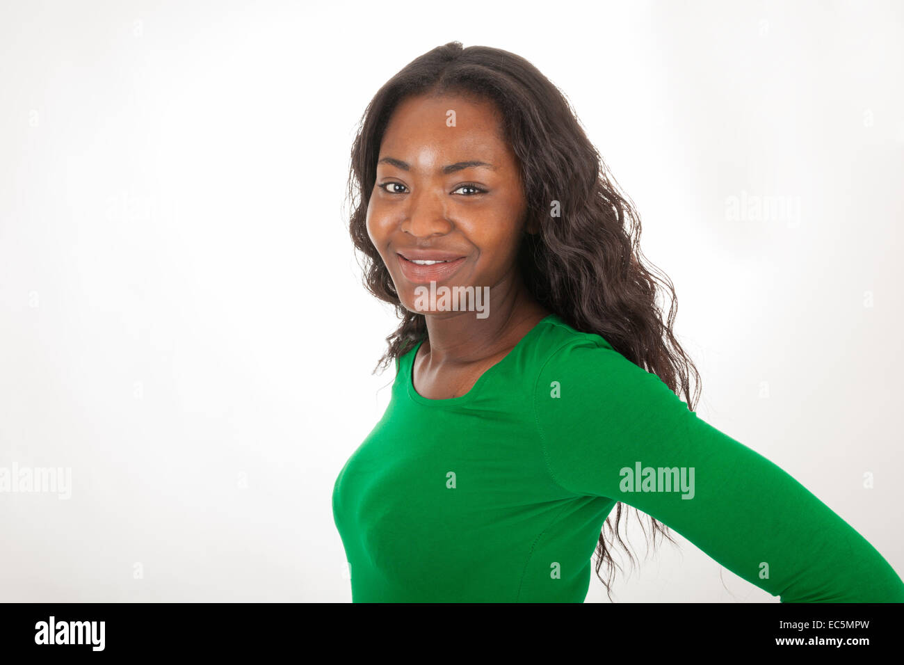 The young colored woman is standing in front of the camera Stock Photo ...