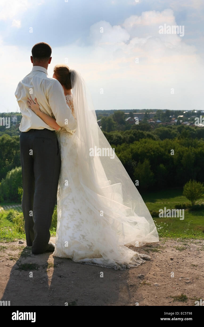 Beautiful the bride and groom on landscape background Stock Photo - Alamy