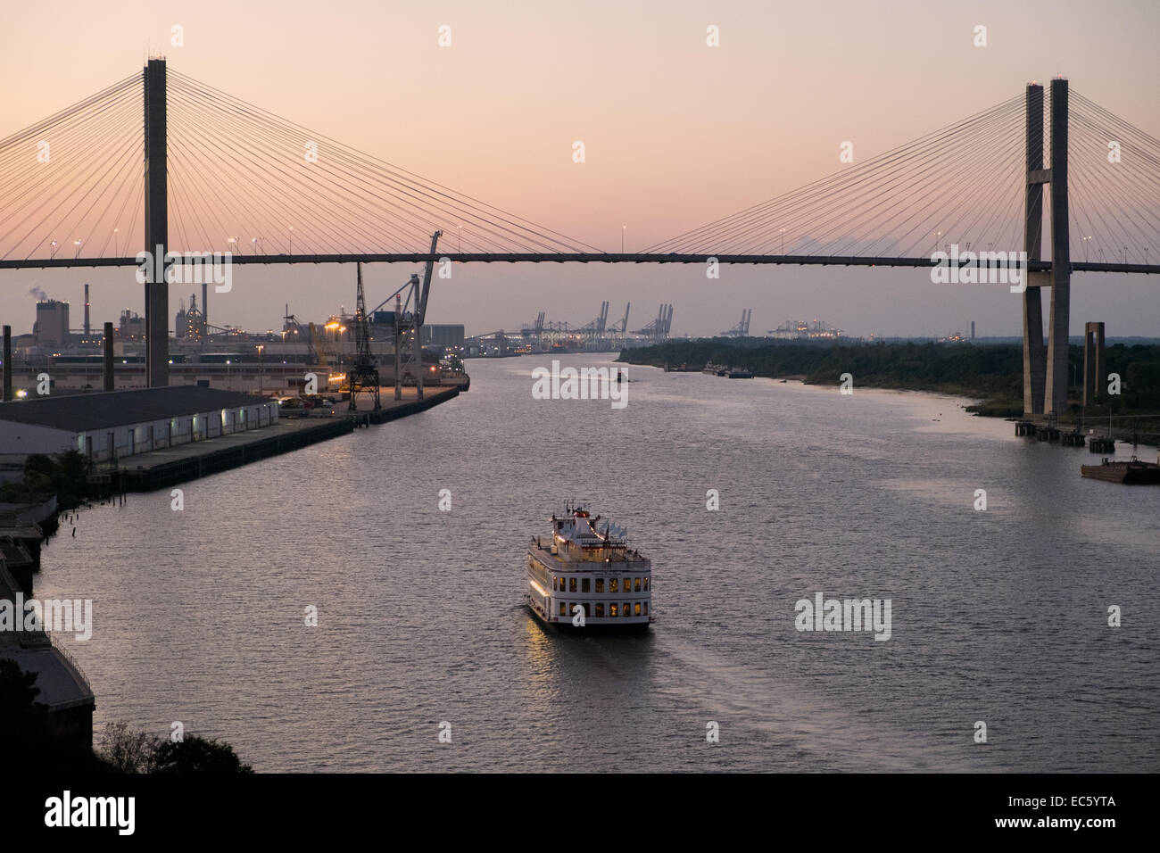 Riverboat cruising at dusk on Savannah River below the Eugene Talmadge ...