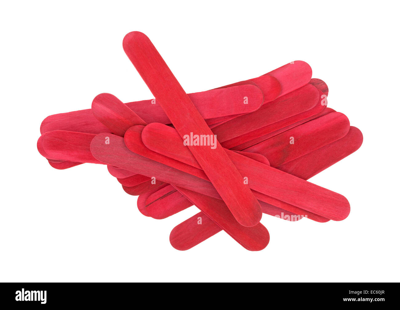 A jumble of holiday craft sticks dyed in red on a white background ...