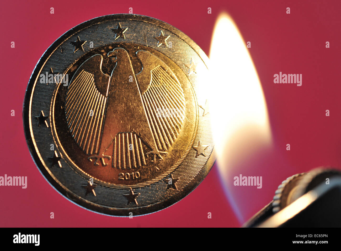 The german federal eagle on a two-euro coin, photographed on saturday ...