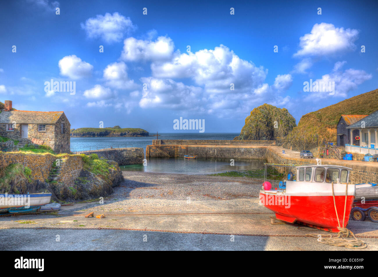 Cornish harbour Mullion Cove Cornwall UK the Lizard peninsula with red ...