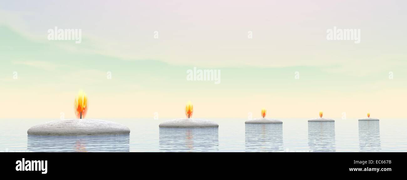 Stones with fire lights as steps on the ocean by day time Stock Photo ...