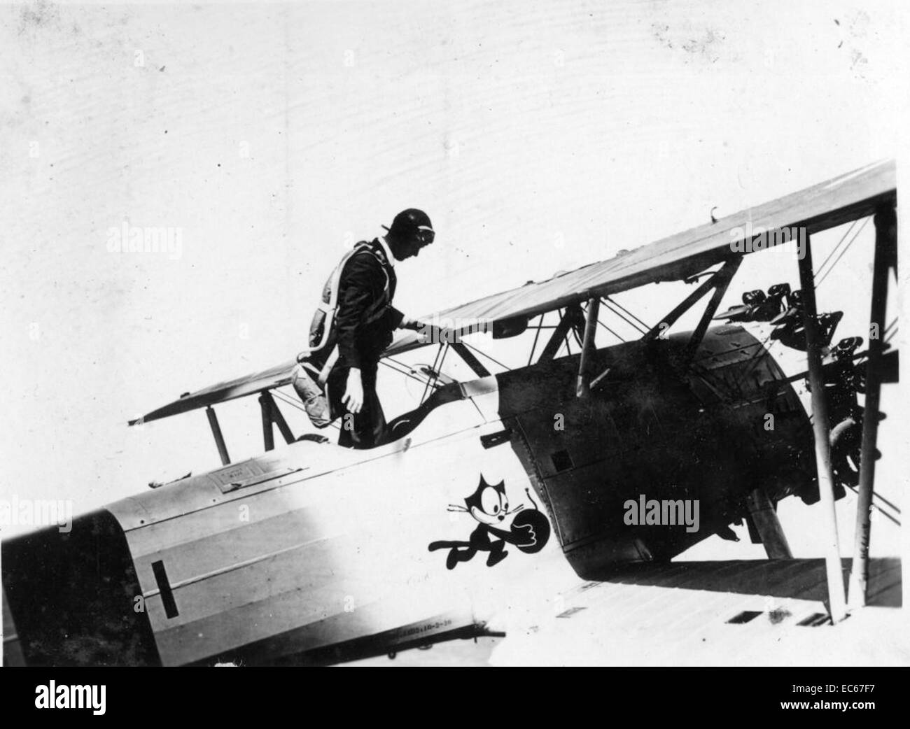 This image features aviation pioneer Charles Lindbergh in the cockpit ...