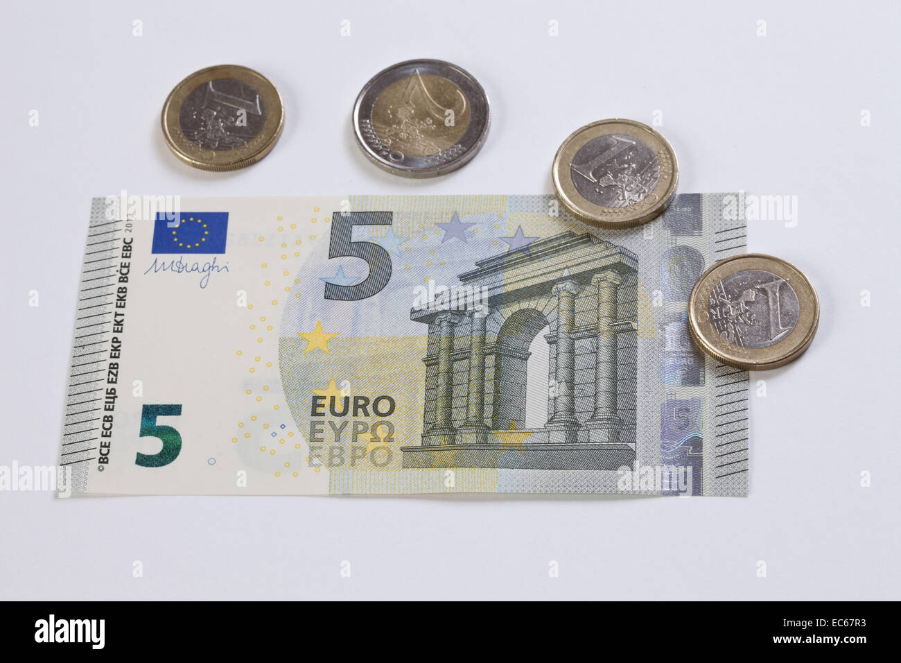 Euro coins and 5 Euro banknote Stock Photo - Alamy