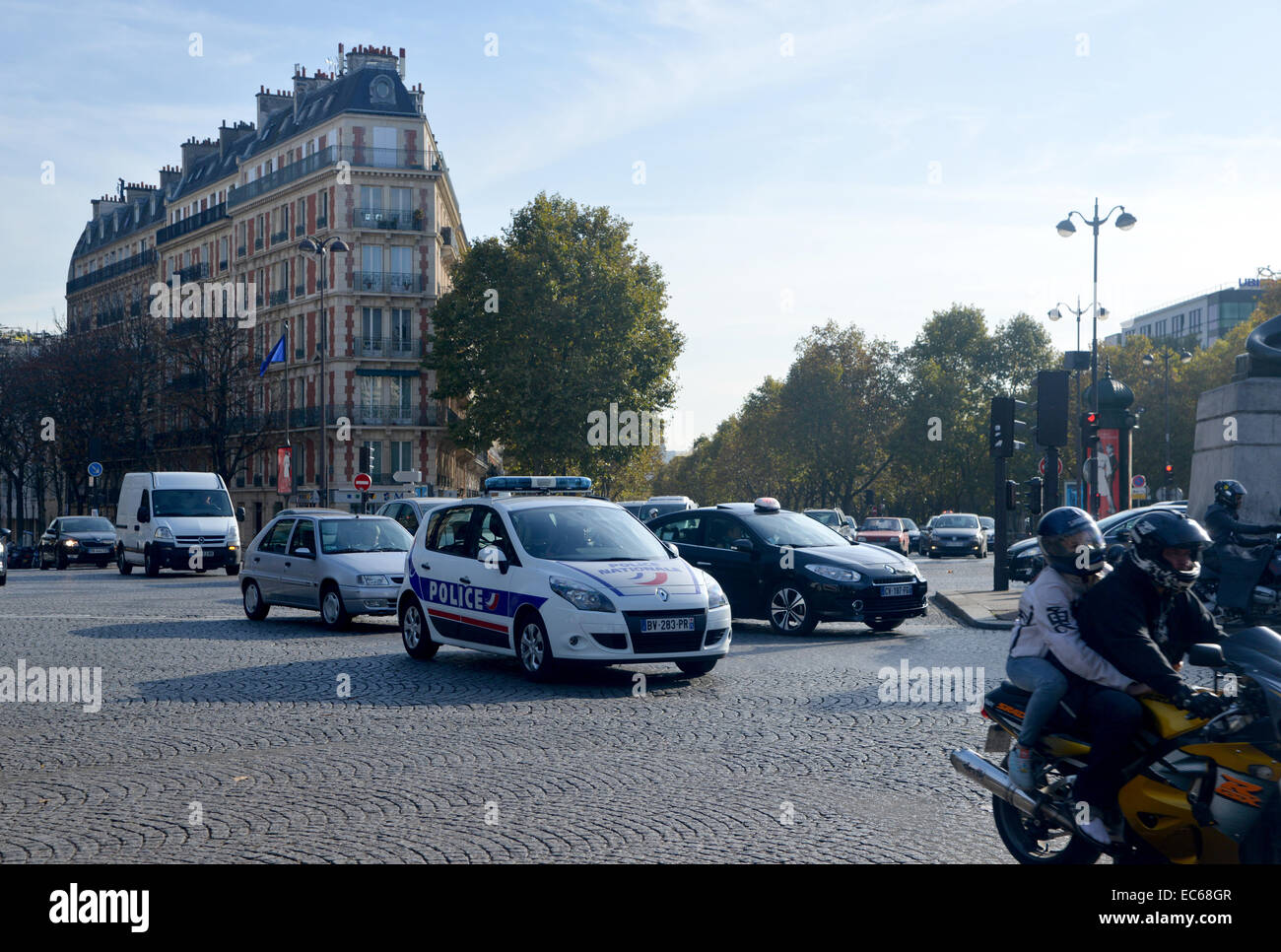 Paris Police car crosses a busy junction with other traffic Stock Photo ...