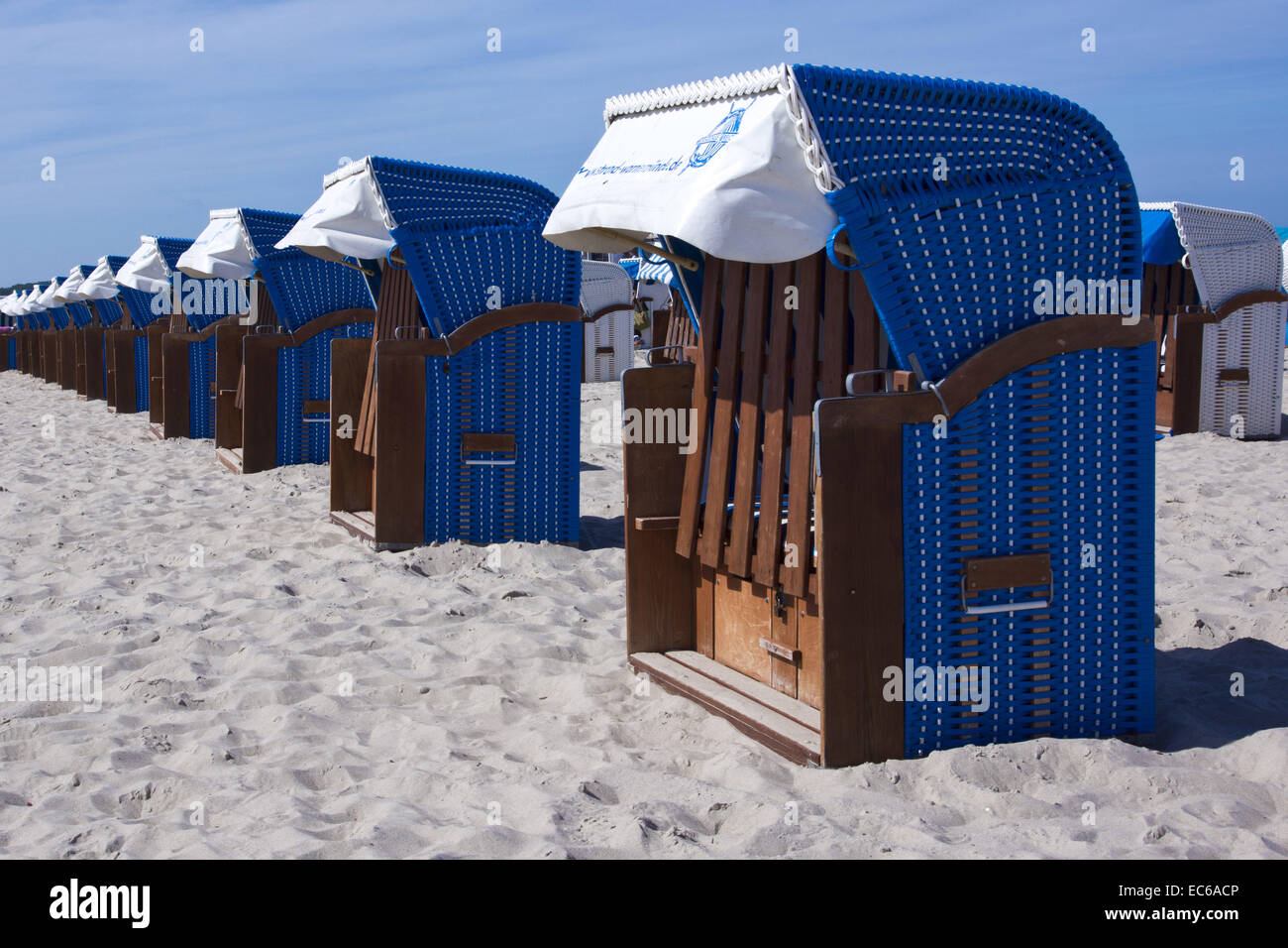 Roofed wicker beach chairs on the beach of Warnemuende Hanseatic City ...
