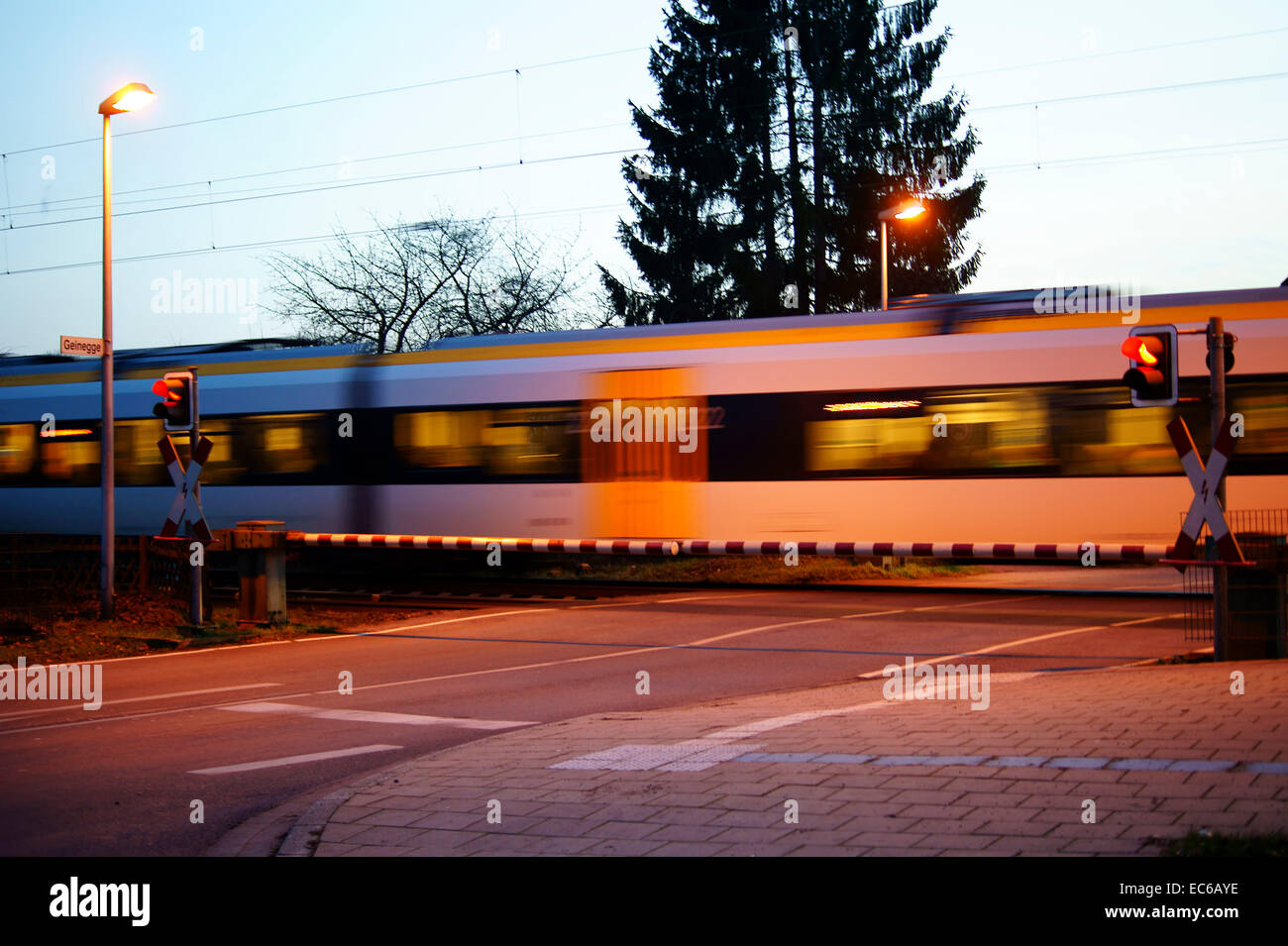 Railroad crossing at night Stock Photo - Alamy
