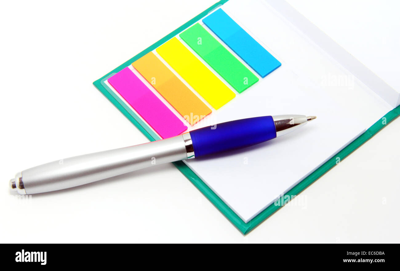 Blue pencil on opened note on white background Stock Photo - Alamy
