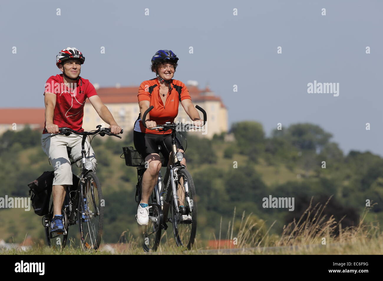 Two people riding their bikes Stock Photo - Alamy