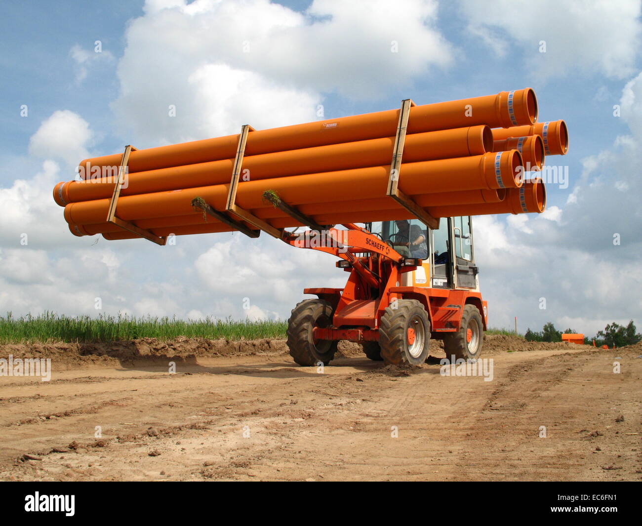 Wheel loader with tubes Stock Photo - Alamy