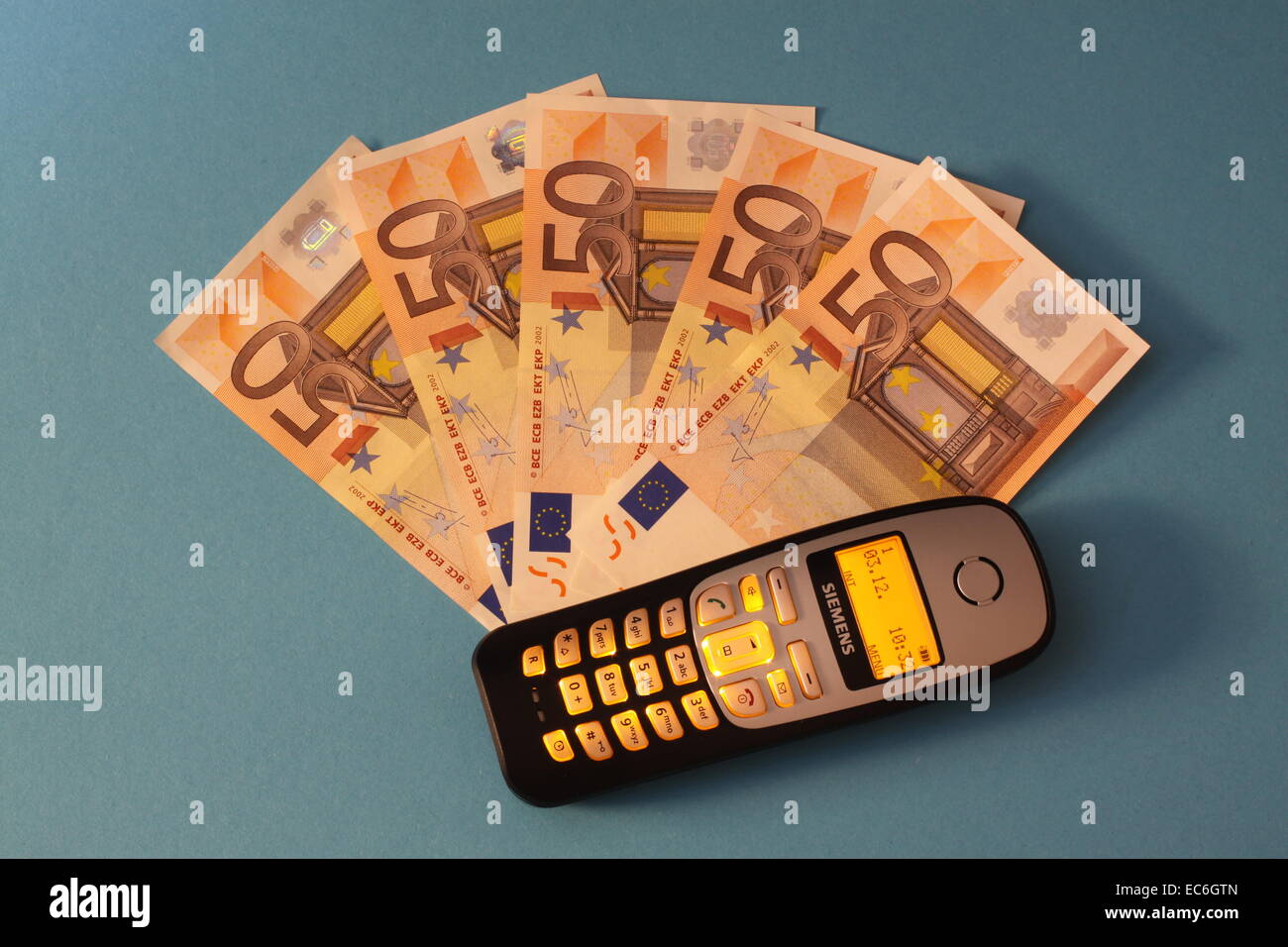 Phone and money Stock Photo - Alamy