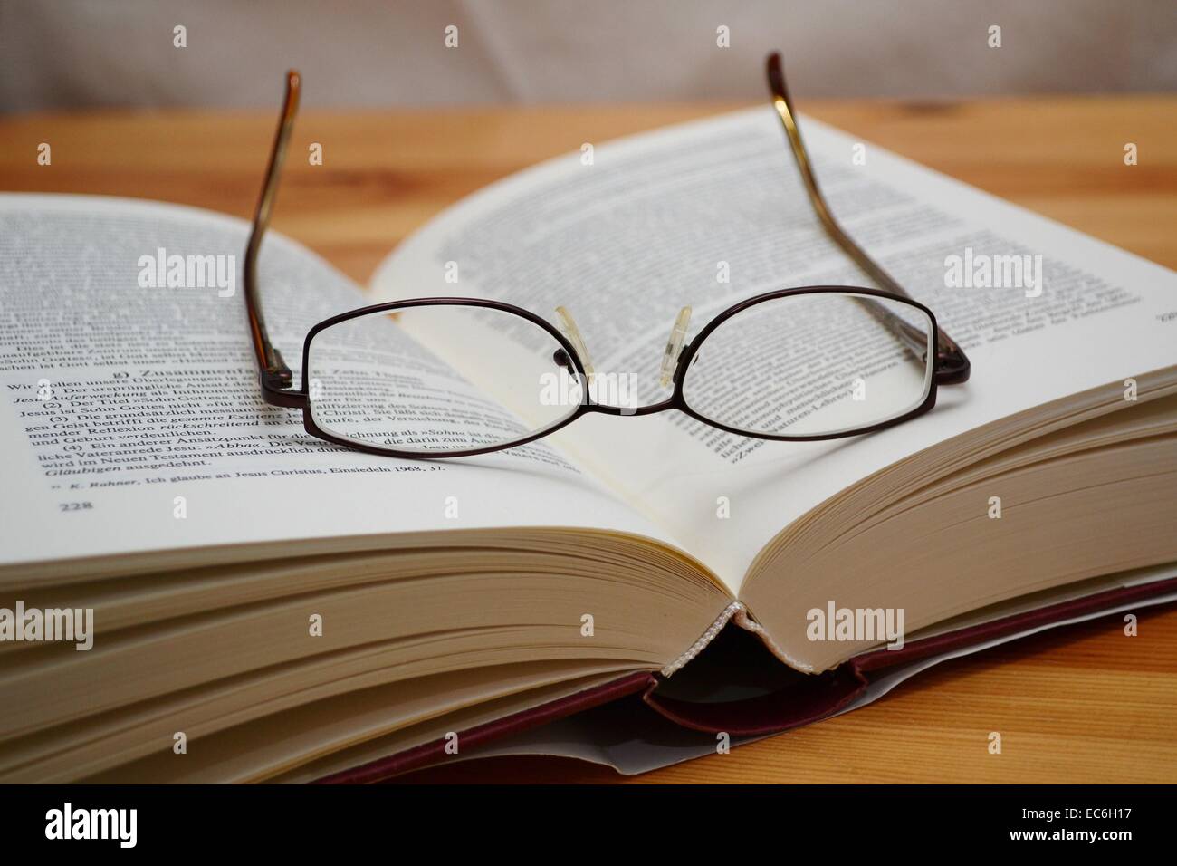 open book with glasses Stock Photo - Alamy