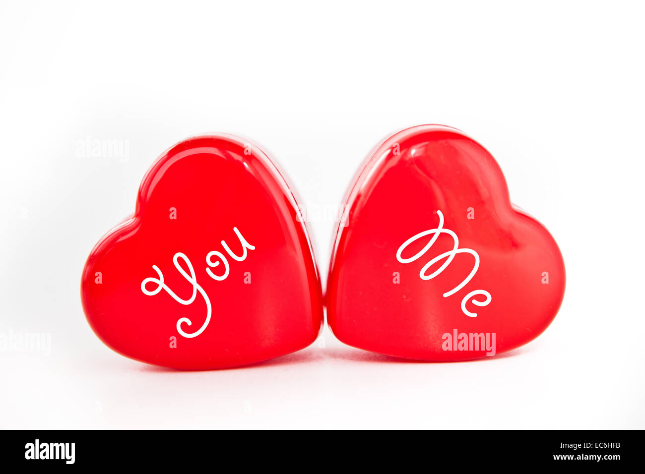 Two red hearts on white Stock Photo - Alamy