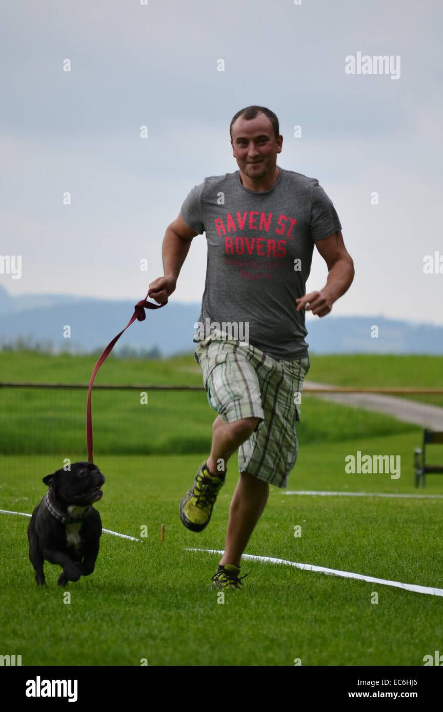 Man running with his dog Stock Photo - Alamy