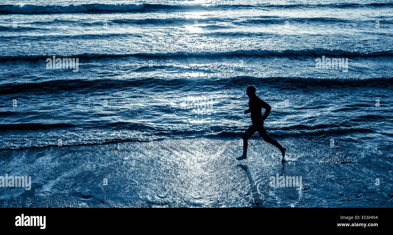 Male athlete beach running hi-res stock photography and images - Alamy