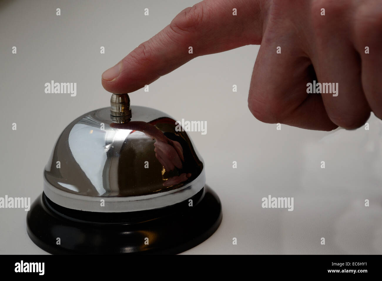 Table bell is pressed Stock Photo - Alamy