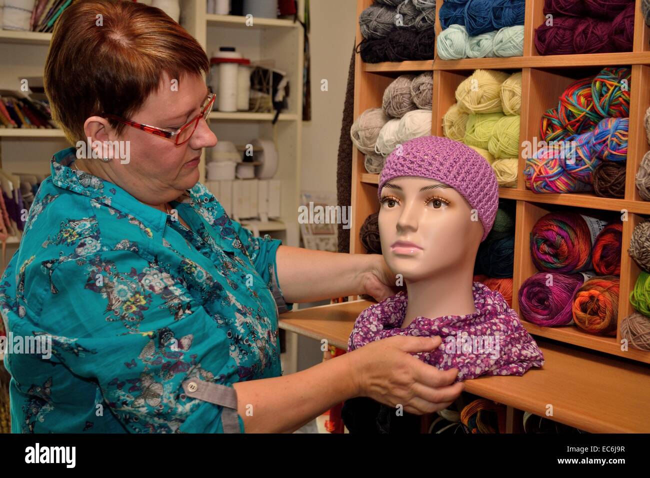 Textiles seller decorated mannequin Stock Photo - Alamy