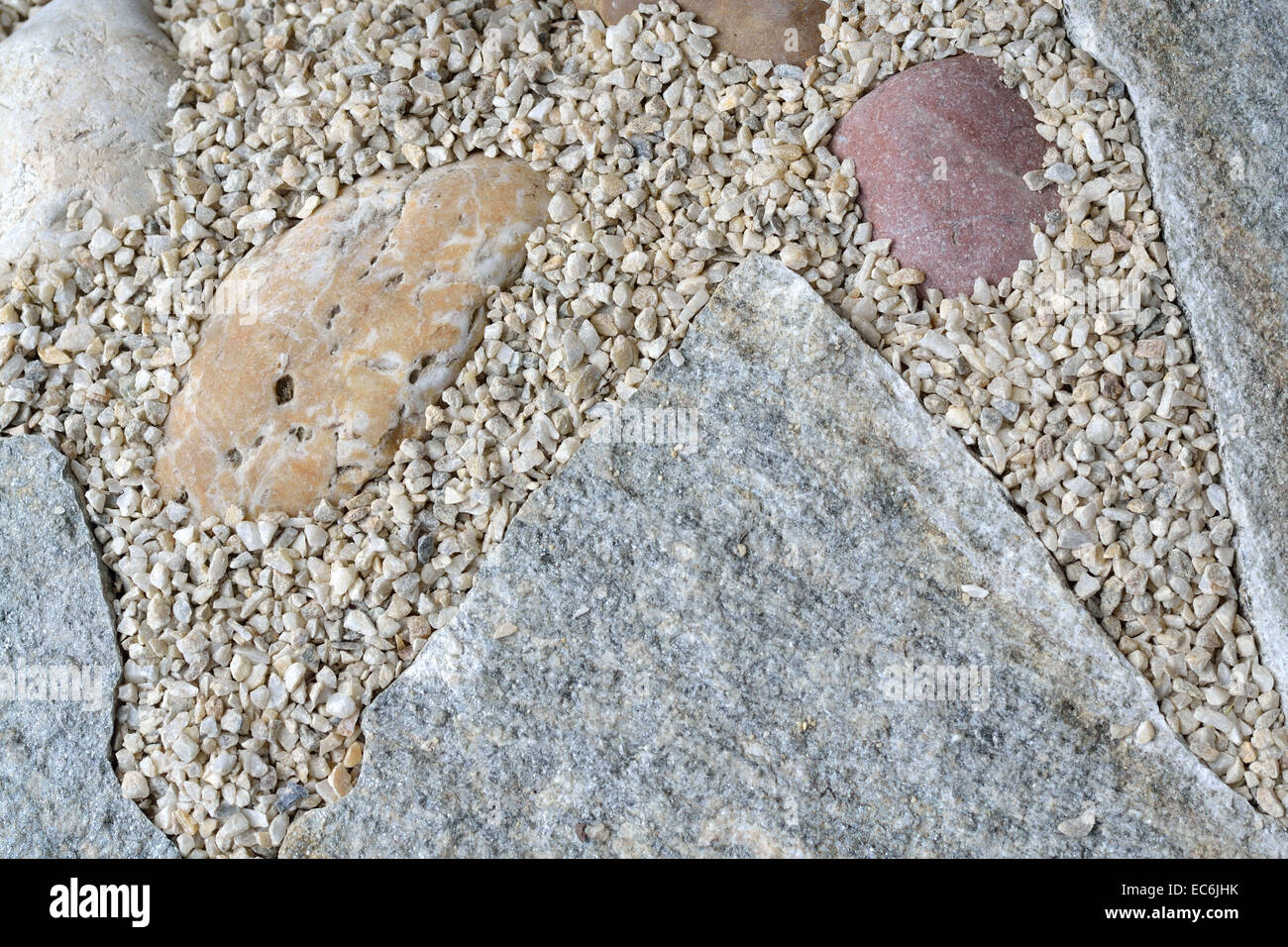 On the ground laid stone slabs and gravel Stock Photo - Alamy