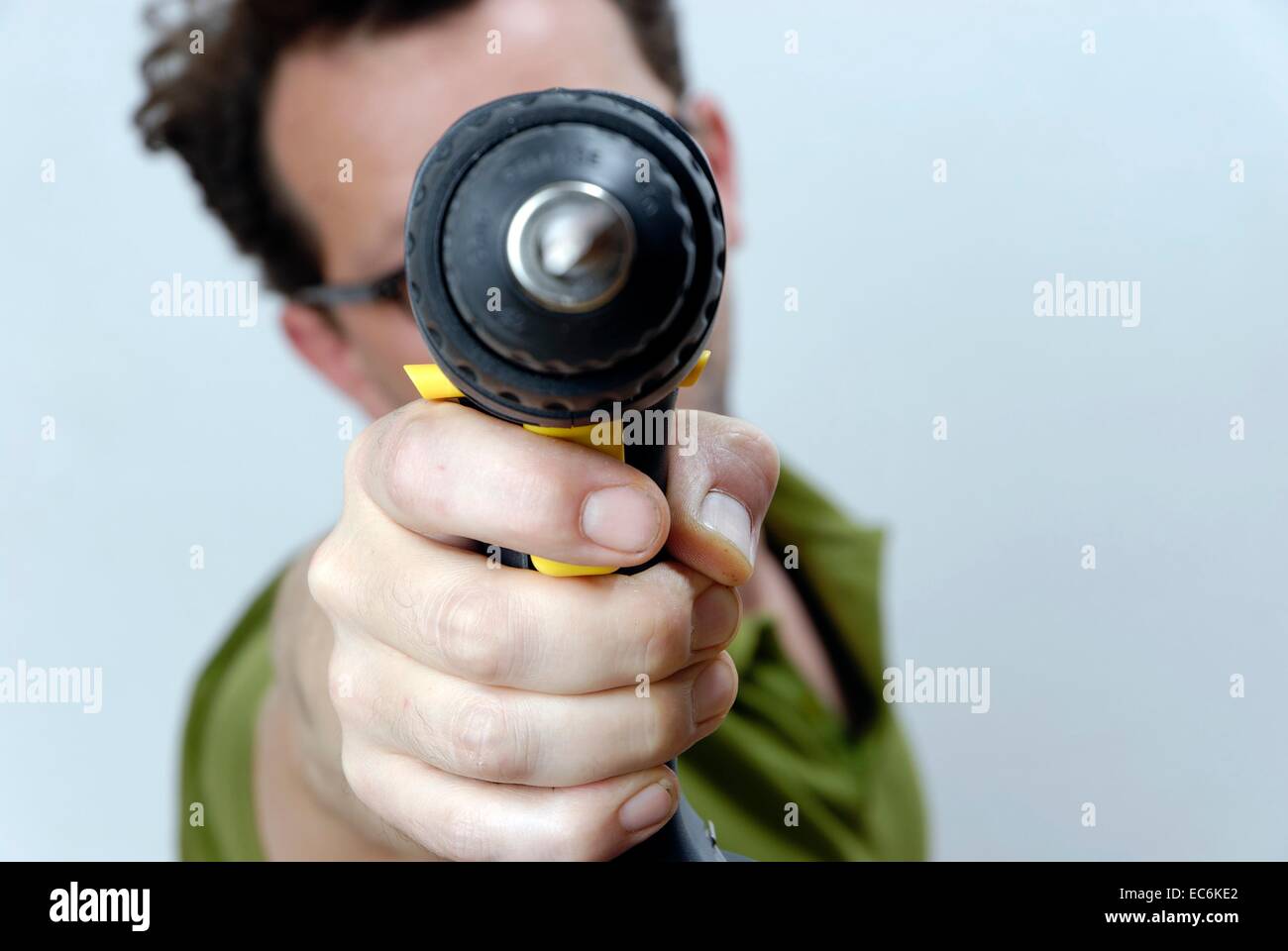 Man with screwdriver in hand Stock Photo - Alamy