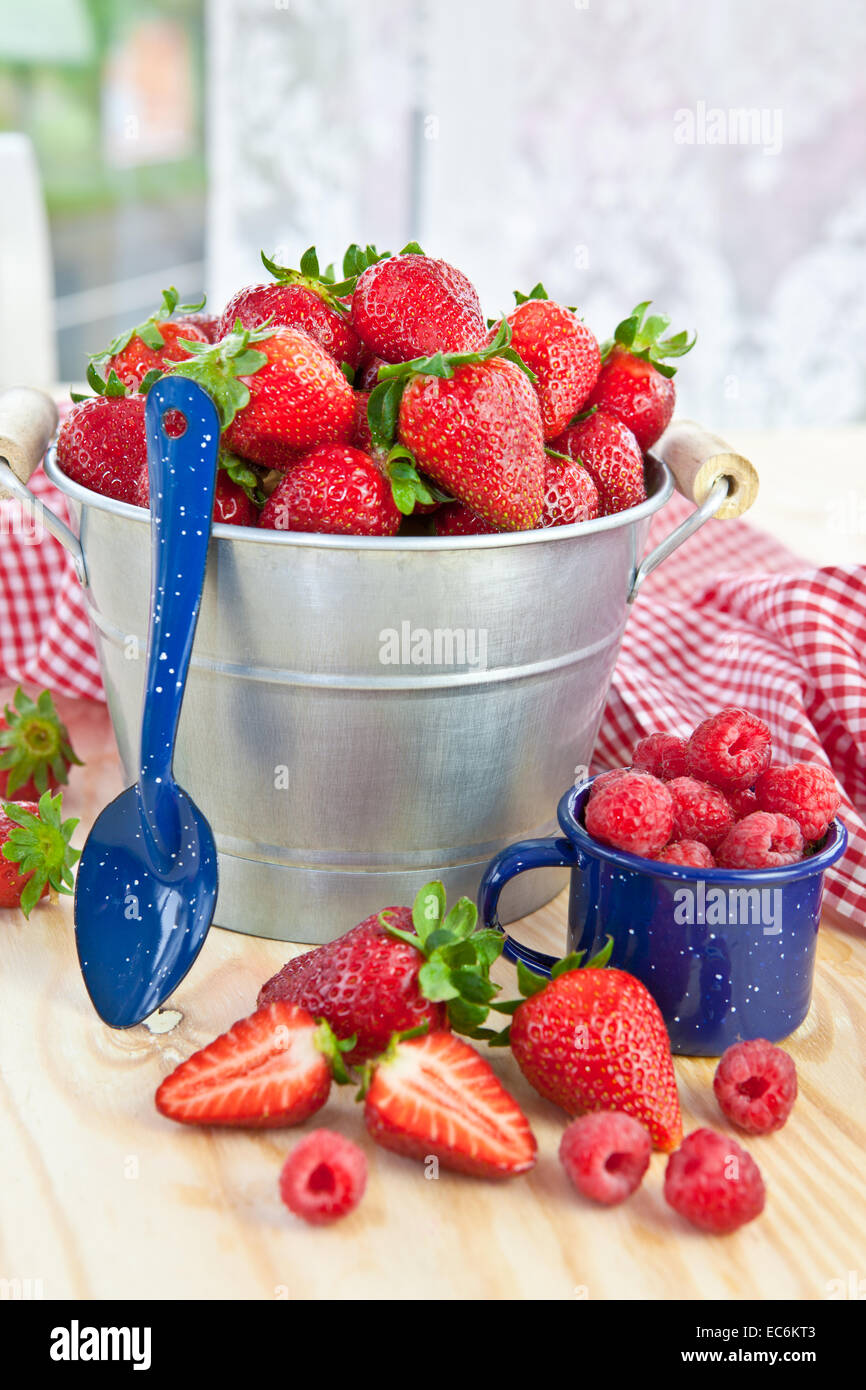 Fresh berries in a vintage tin bucket Stock Photo - Alamy