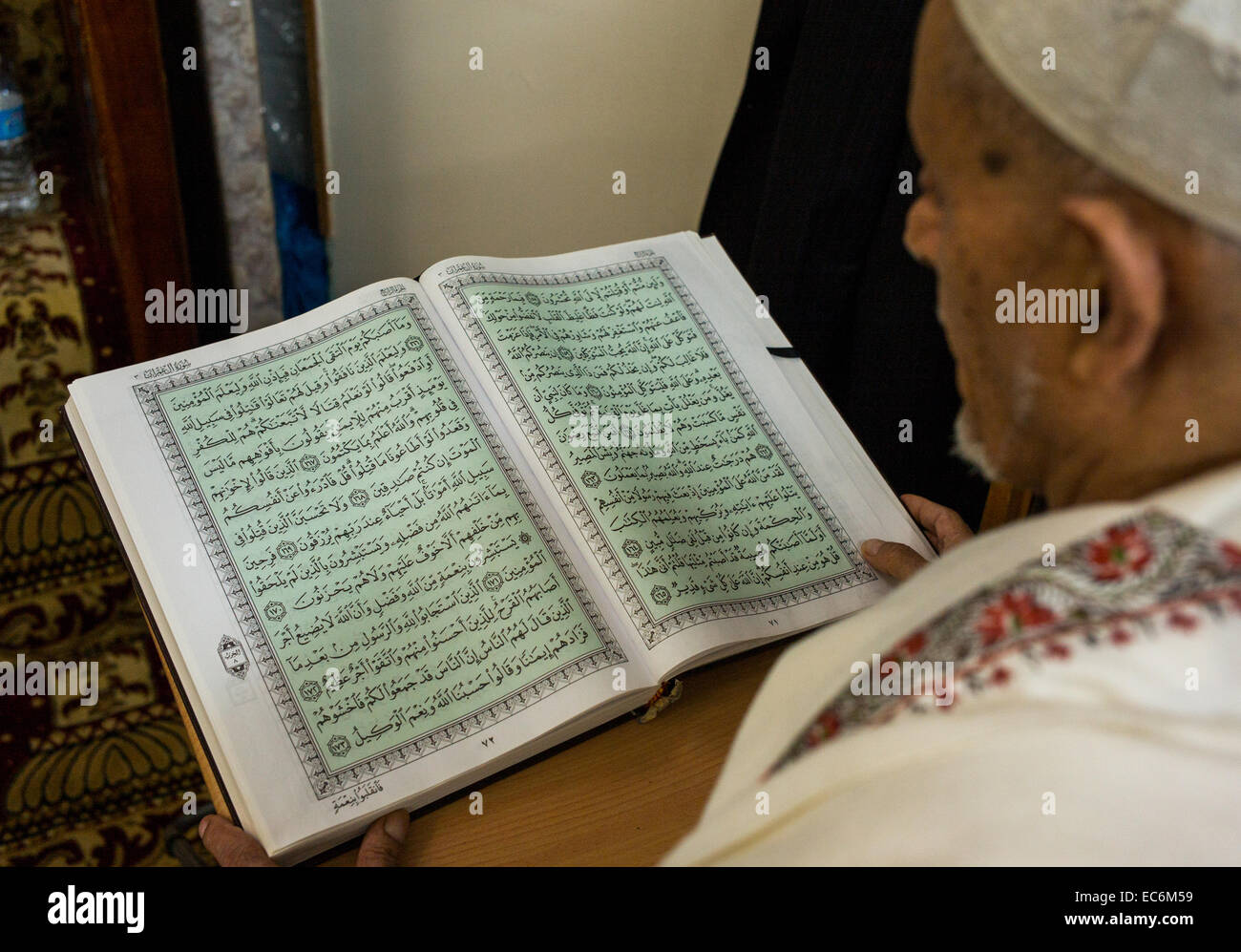 An Arab American Muslim reads the Koran at the Islamic Center of Bay ...