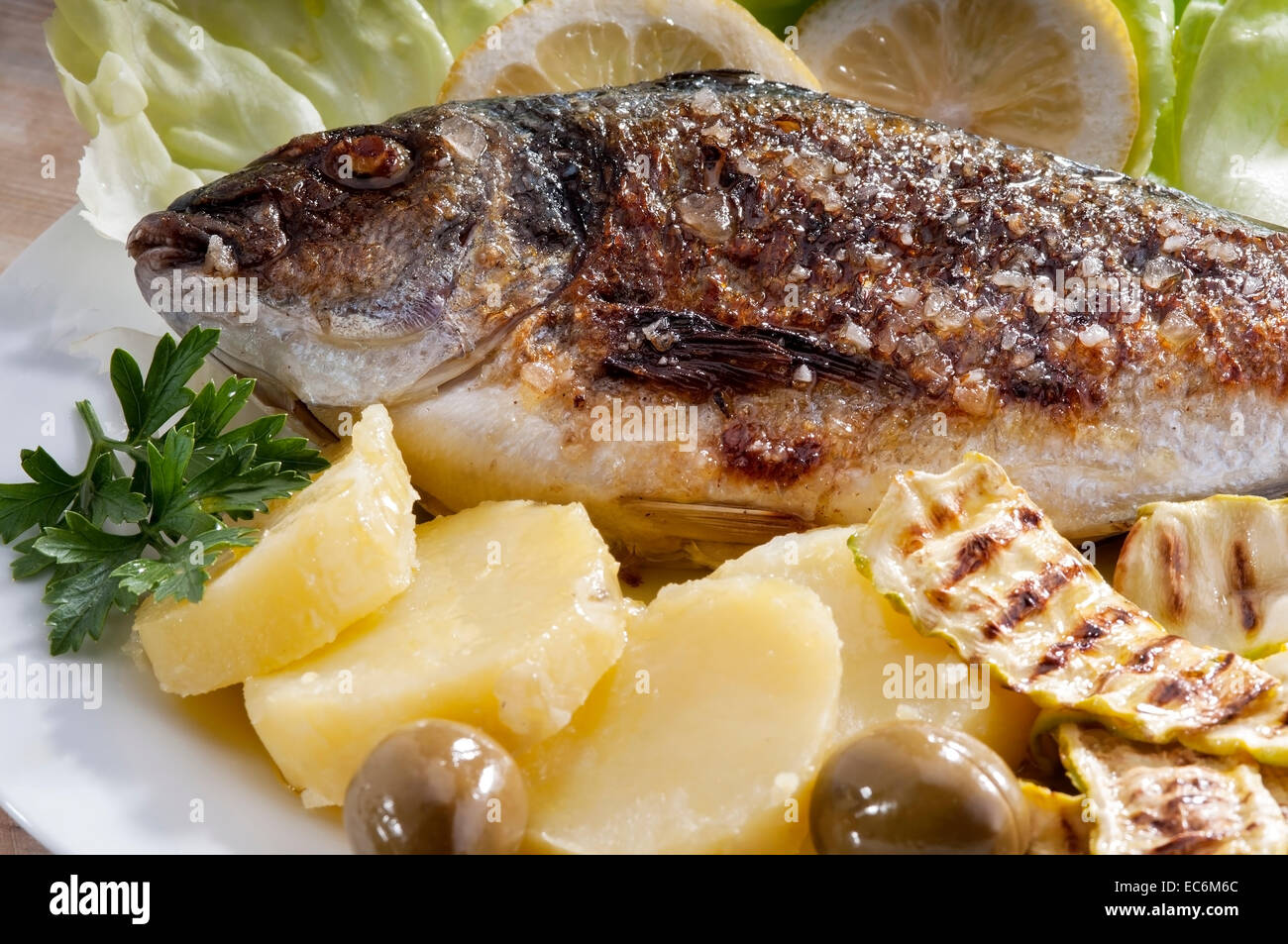 Delicious grilled fish bream, Mediterranean fish, with boiled potatoes ...
