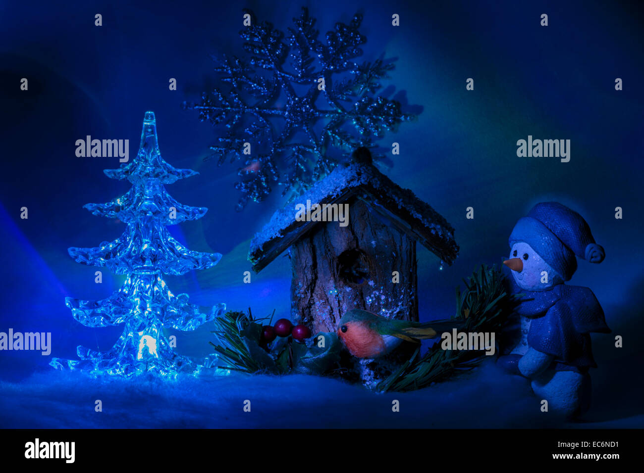 Christmas scene with Christmas Tree, snowman and robin on branch Stock ...