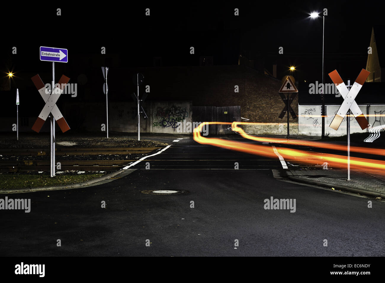 Train-Crossing at night. Long time exposure Stock Photo - Alamy