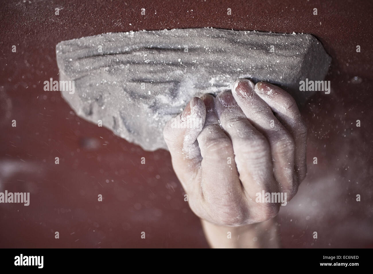 Climbers hand on a grip in an indoor climbing hall Stock Photo - Alamy