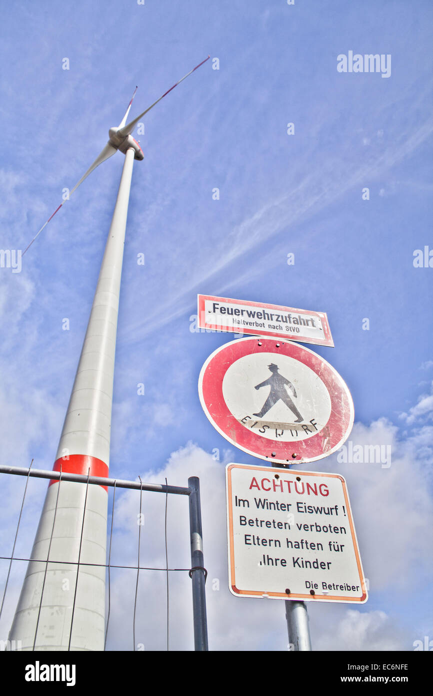 Windmill with warning sign Stock Photo - Alamy
