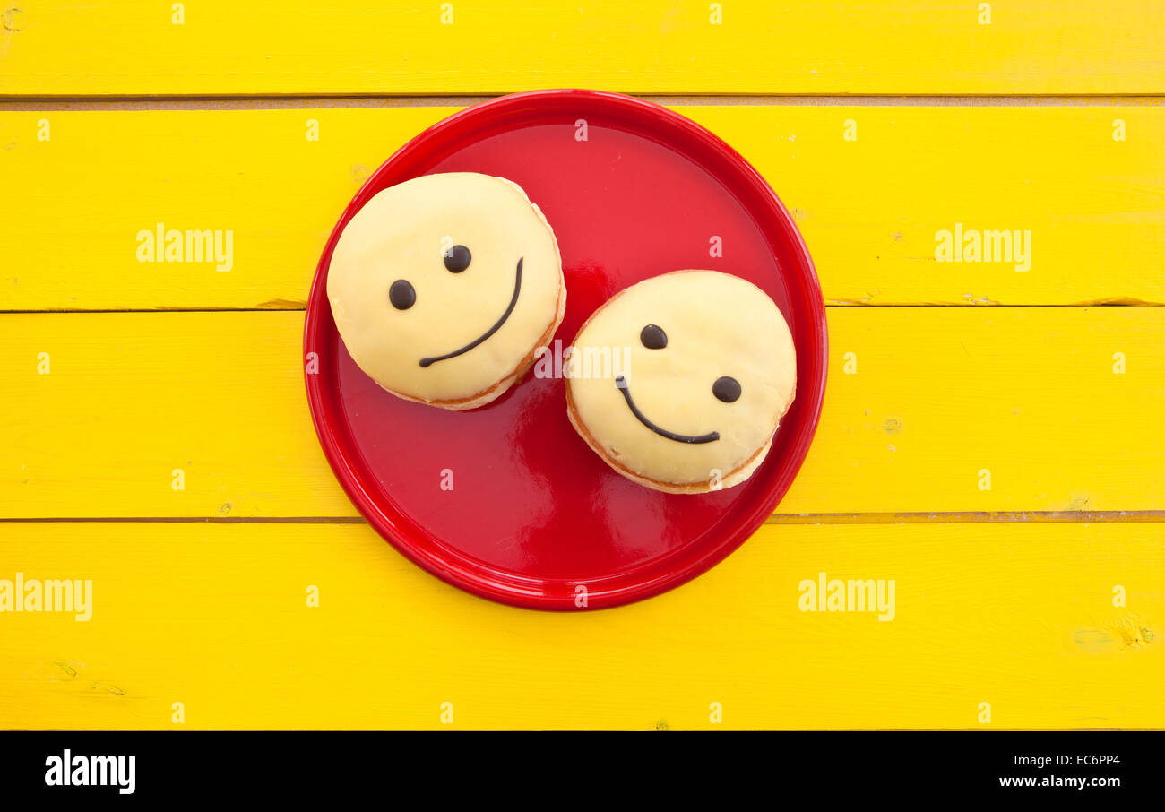 Smiley face donut Stock Photo - Alamy