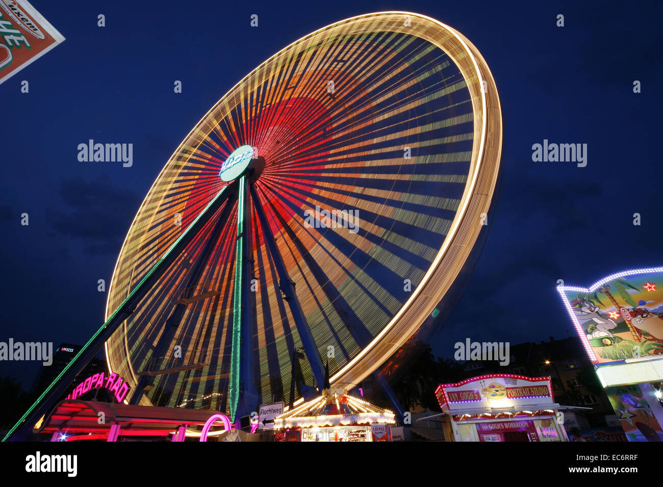 ride ferris wheel carnival fair festival colorful streaks of light in ...