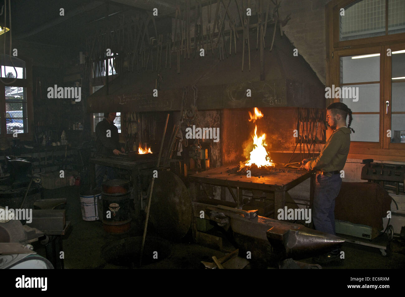 blacksmith working at flaming forge Stock Photo - Alamy