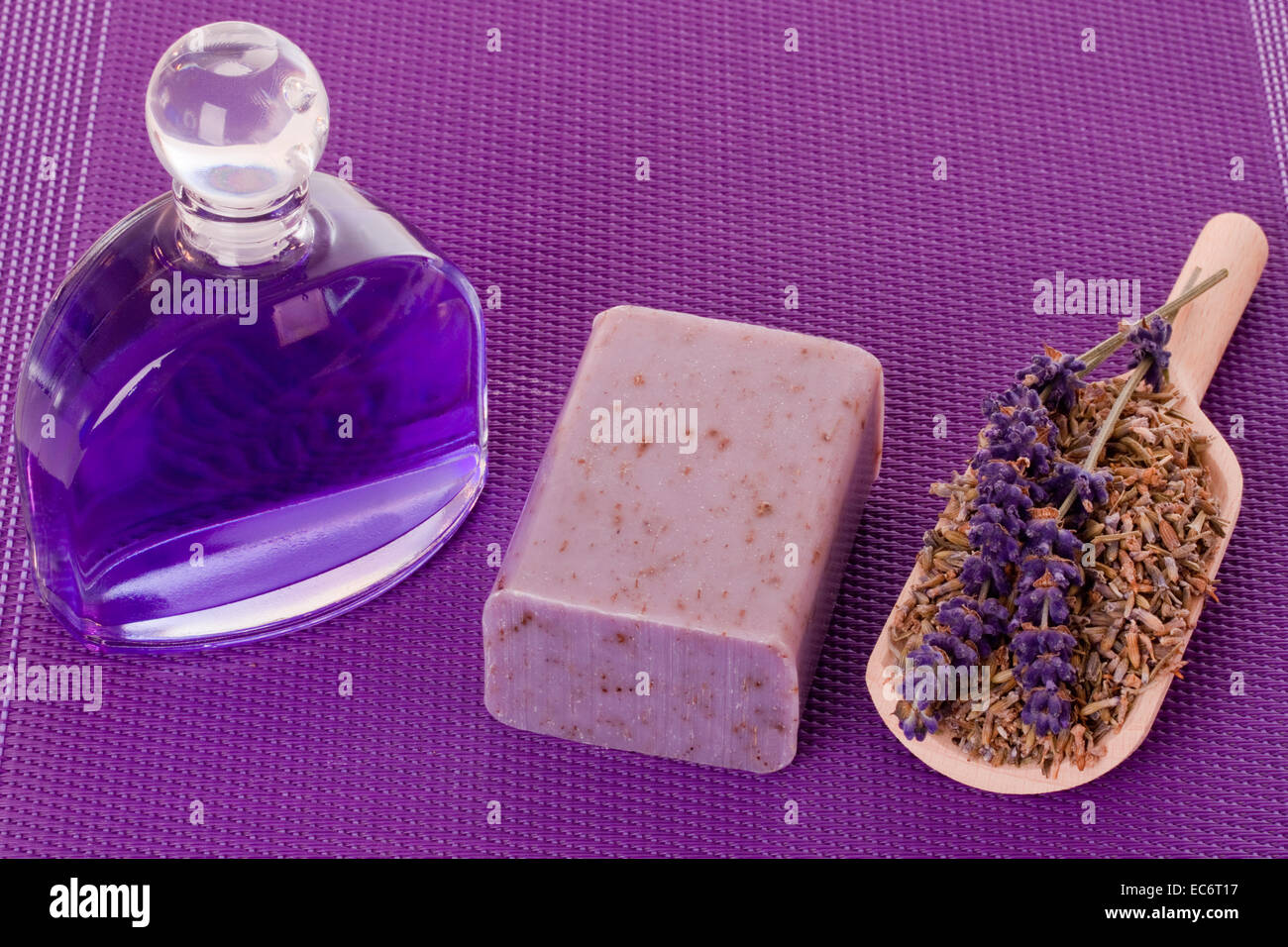 Lavender cosmetics over purple background Stock Photo - Alamy