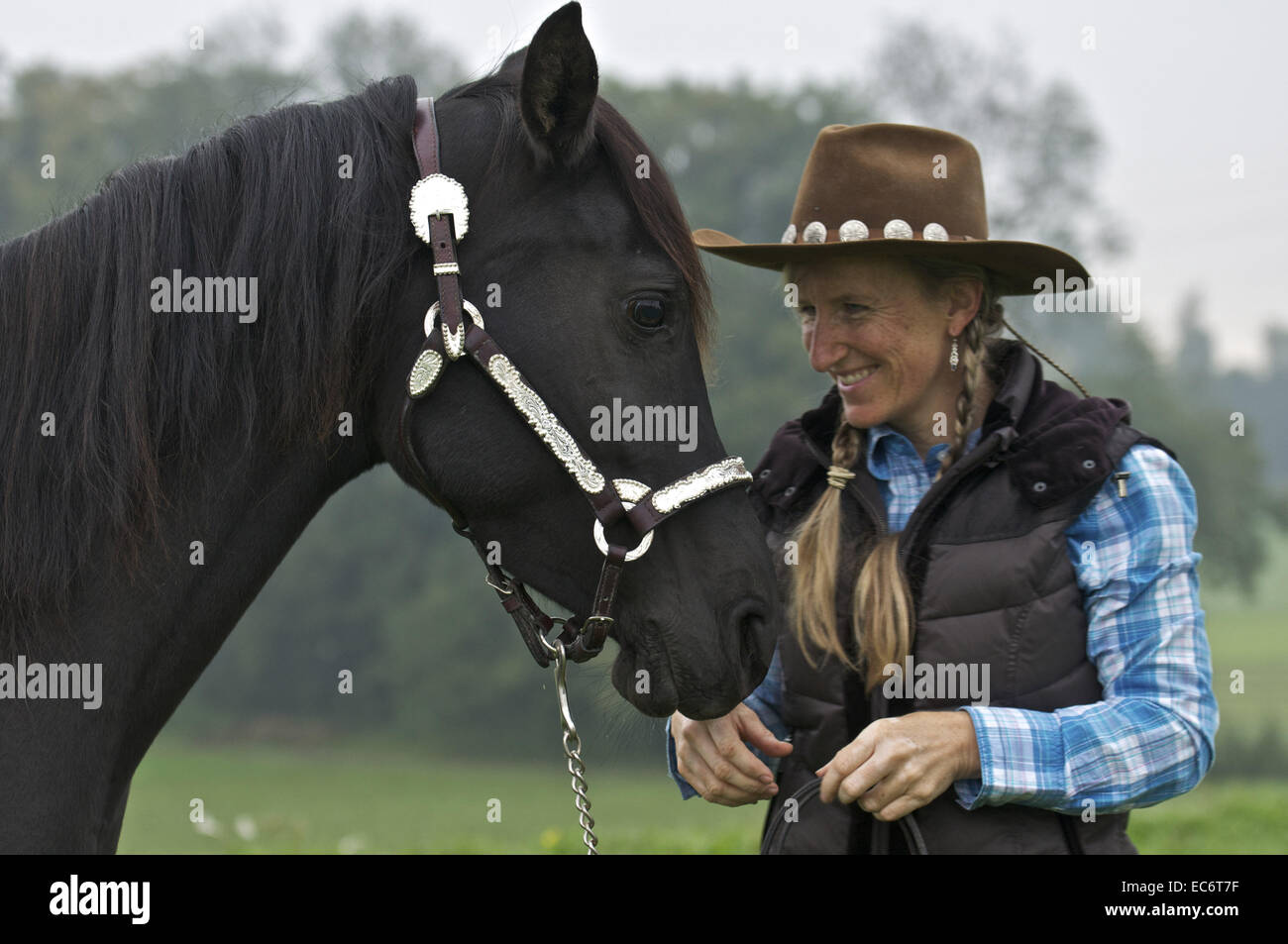 western style riding woman with horse Stock Photo - Alamy