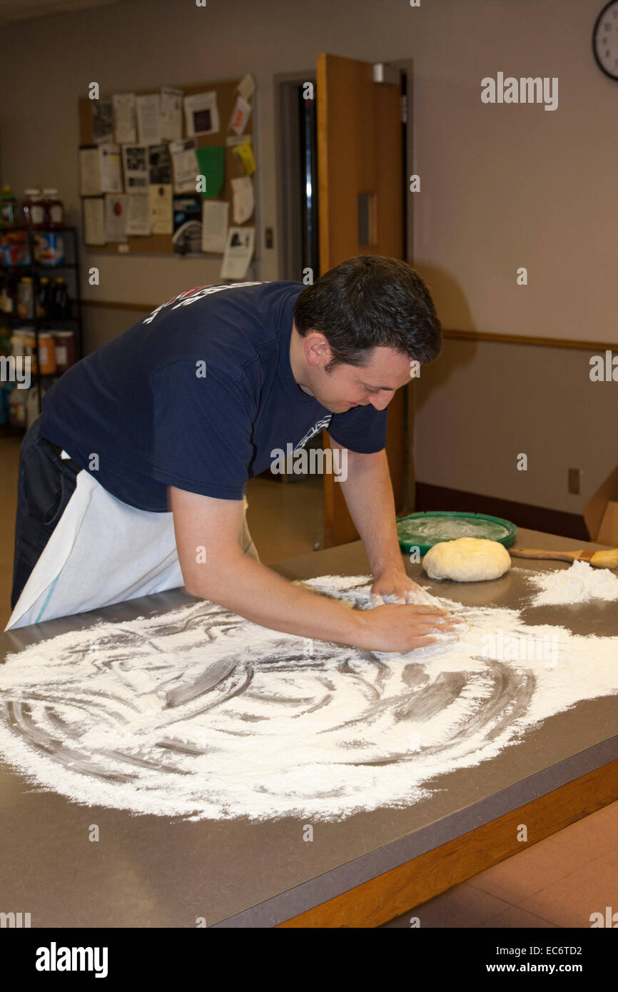 Milwaukee Fire Department firefighter making the traditional pizza ...